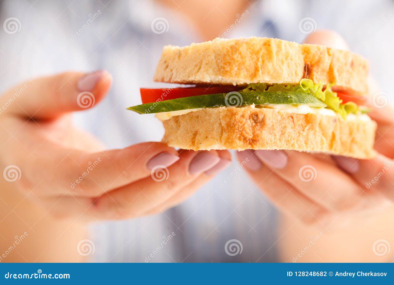 Fresh sandwich in hand stock photo. Image of rolled - 128248682