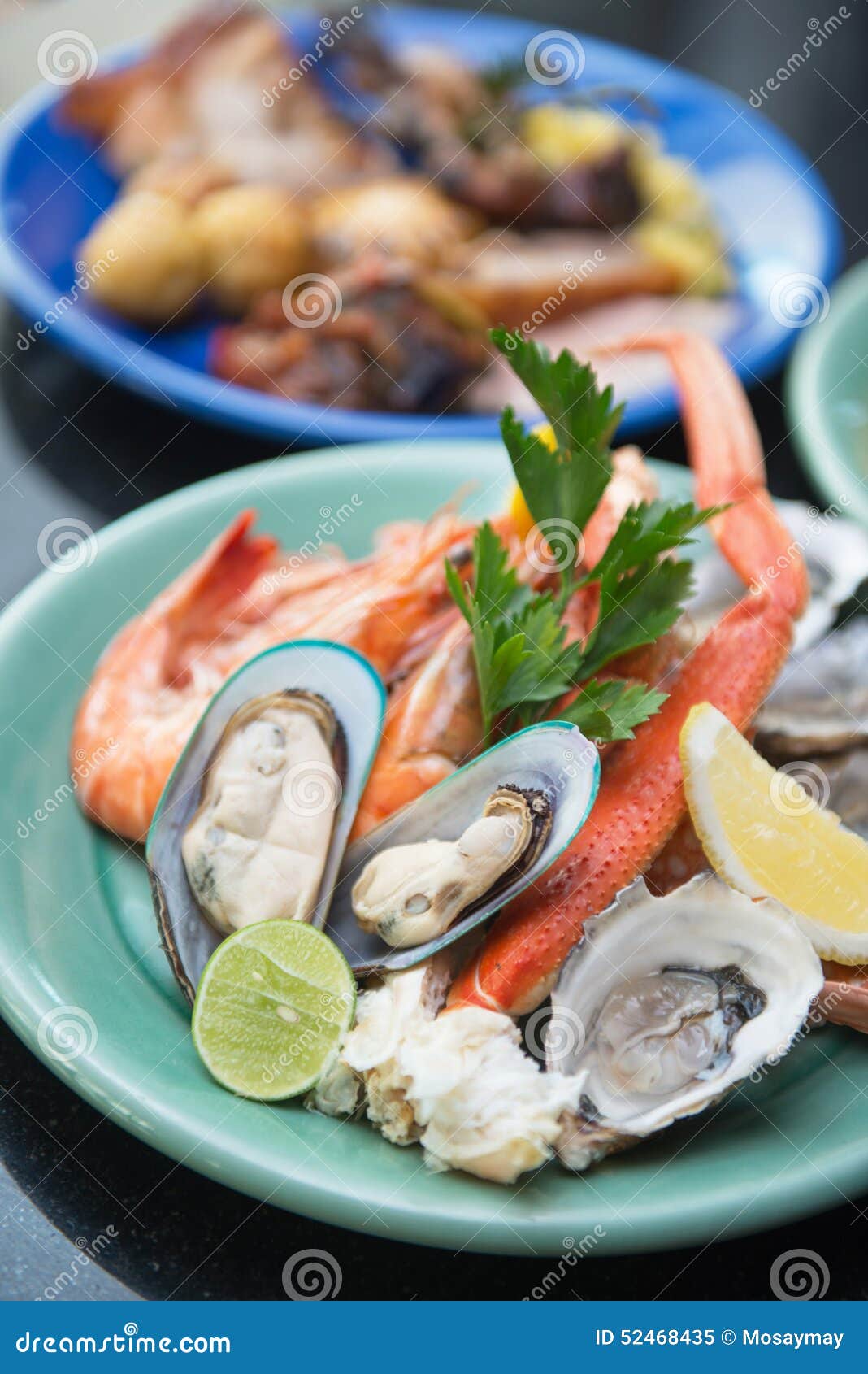 Fresh seafood on a plate stock image. Image of lime, lemon - 52468435