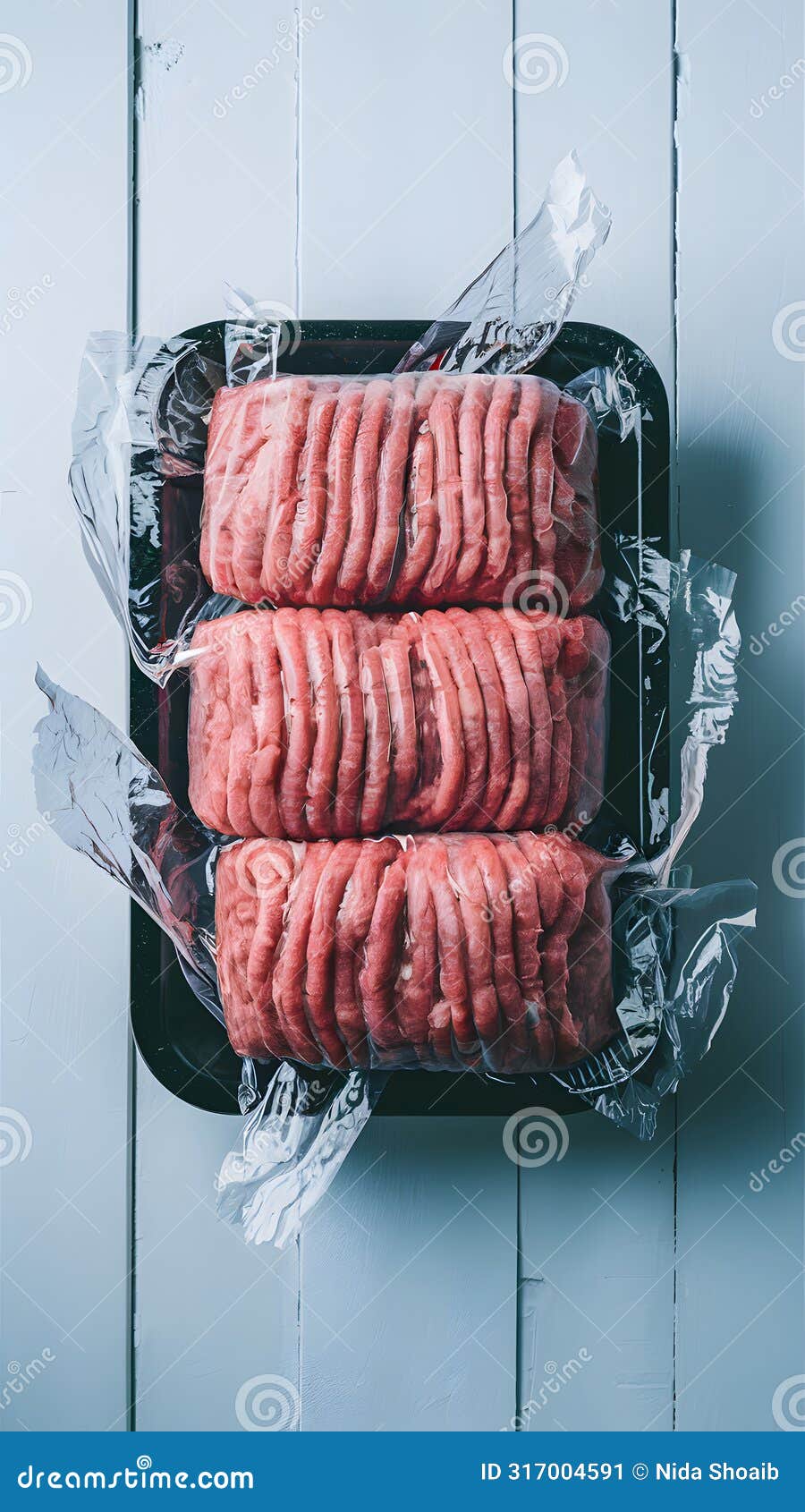 Fresh, Simple, Raw Minced Meat Tightly Packed in Plastic Wrap in a ...
