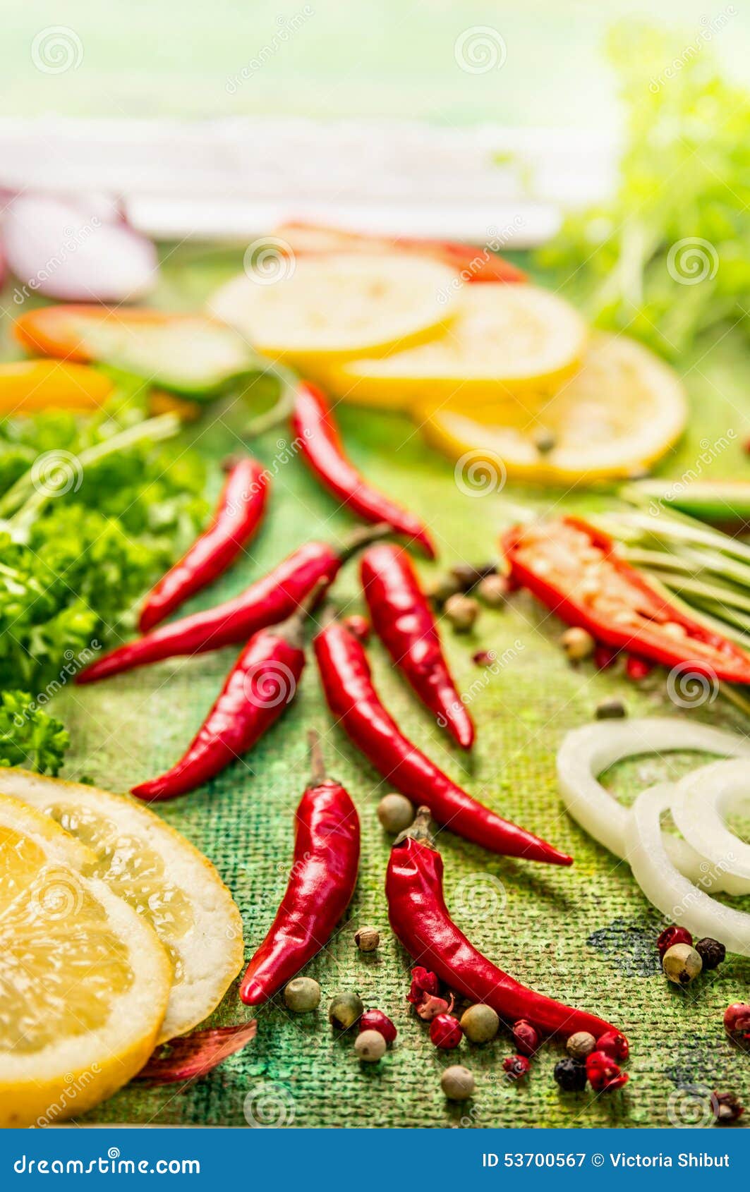 Fresh Spices and Herbs with Lemon on Green Background Stock Image ...