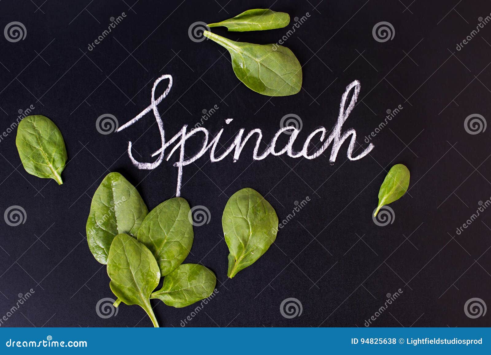 Fresh Spinach Leaves and Lettering Isolated on Black Stock Photo ...