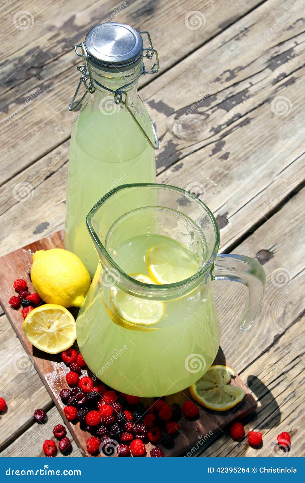 Fresh Squeezed Lemonade in Pitchers with Raspberry Fruit Stock Photo ...