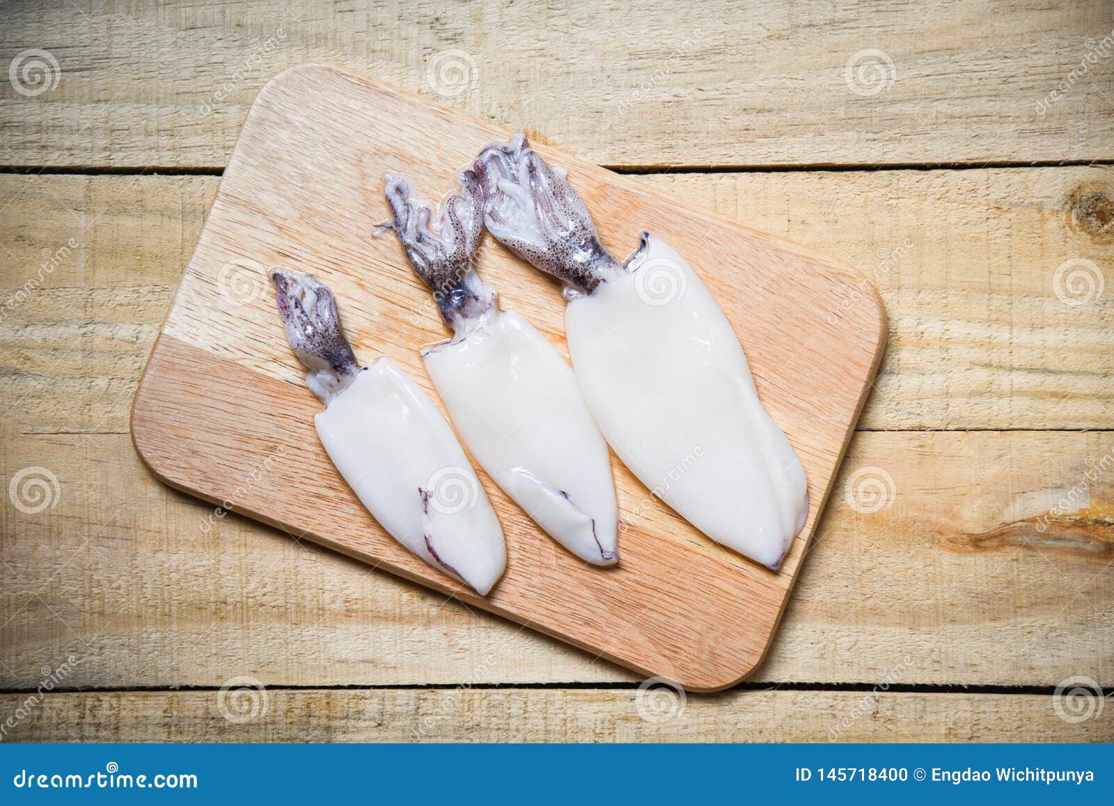 Fresh Squid on Wooden Cutting Board Top View Raw Squid on Wooden Table ...