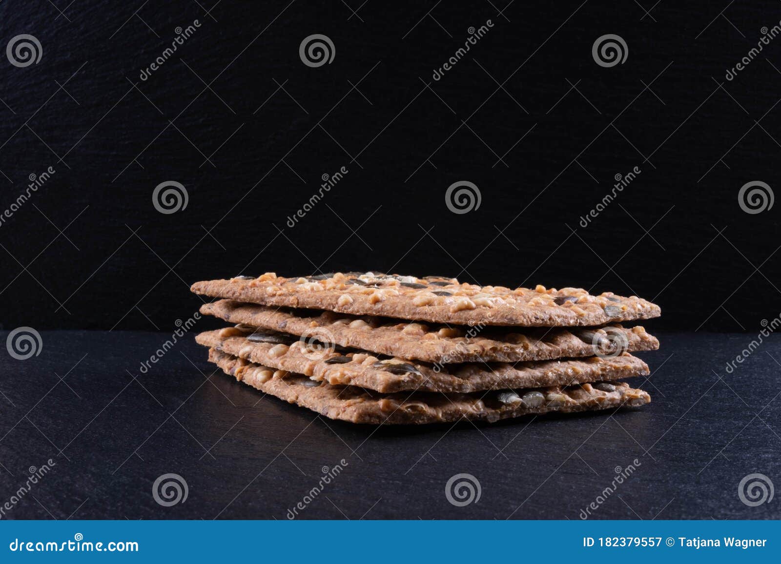 Fresh Stack of Crackers on a Black Stone on a Table Stock Image - Image ...
