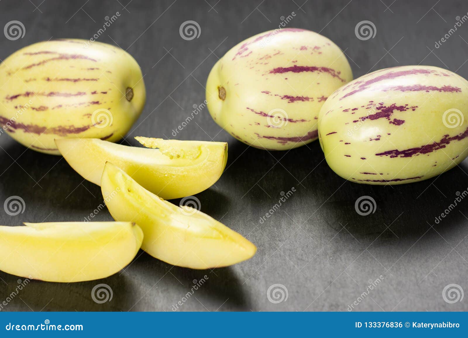 Fresh Striped Pepino Melon on Grey Stone Stock Photo - Image of fleshy ...