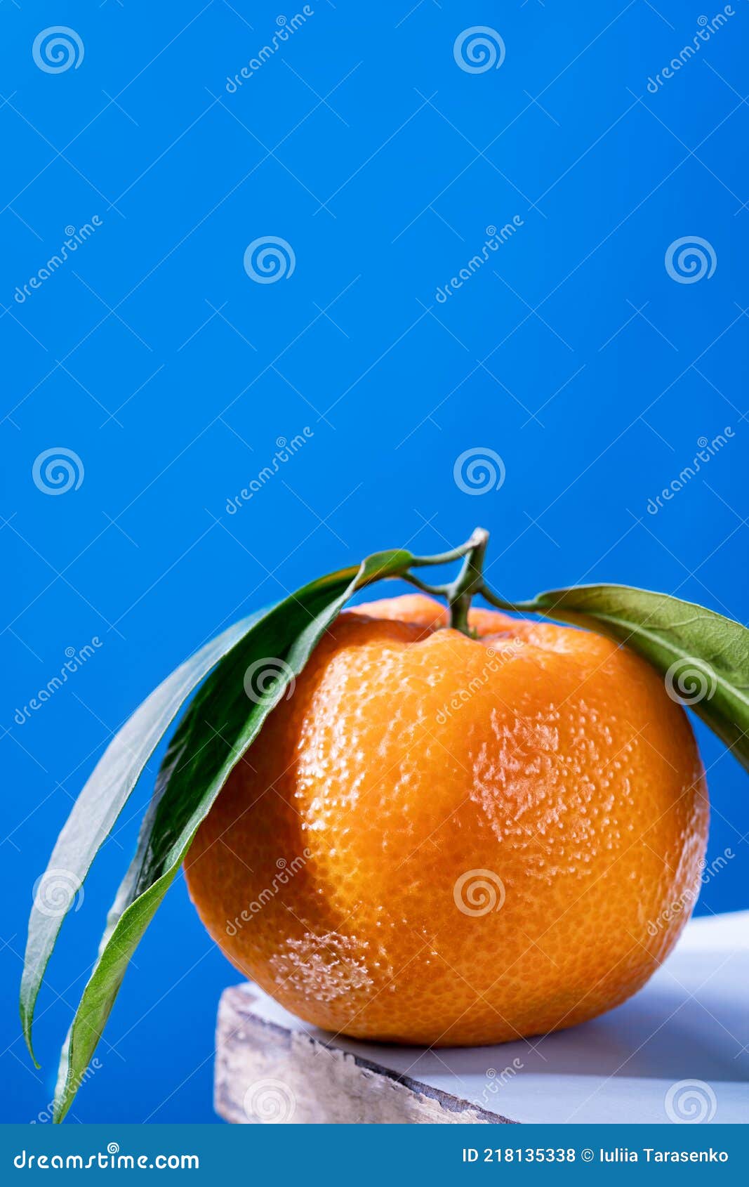 Tangerine with Leaves on Blue Background Stock Photo - Image of blue ...