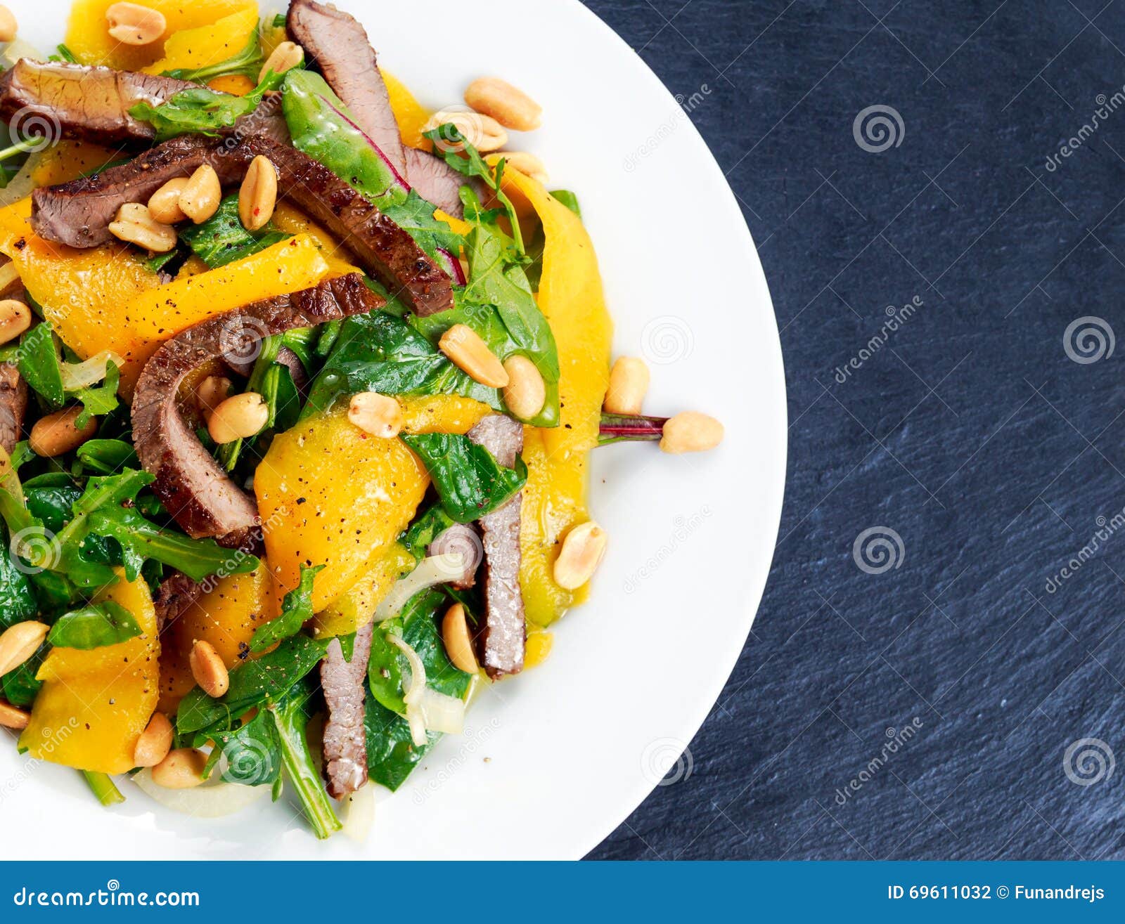 Fresh Tasty Mango, Beef Salad with Vegetables and Nuts. Stock Photo ...