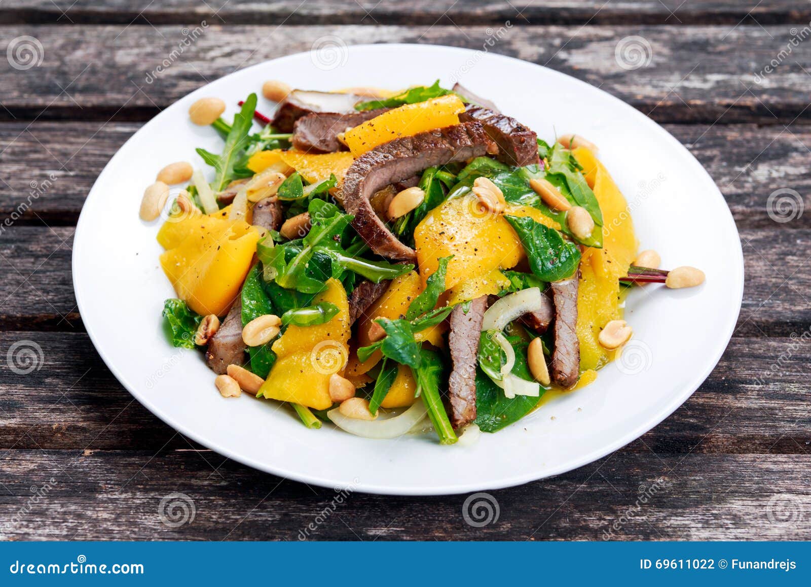 Fresh Tasty Mango, Beef Salad with Vegetables and Nuts. Stock Photo ...