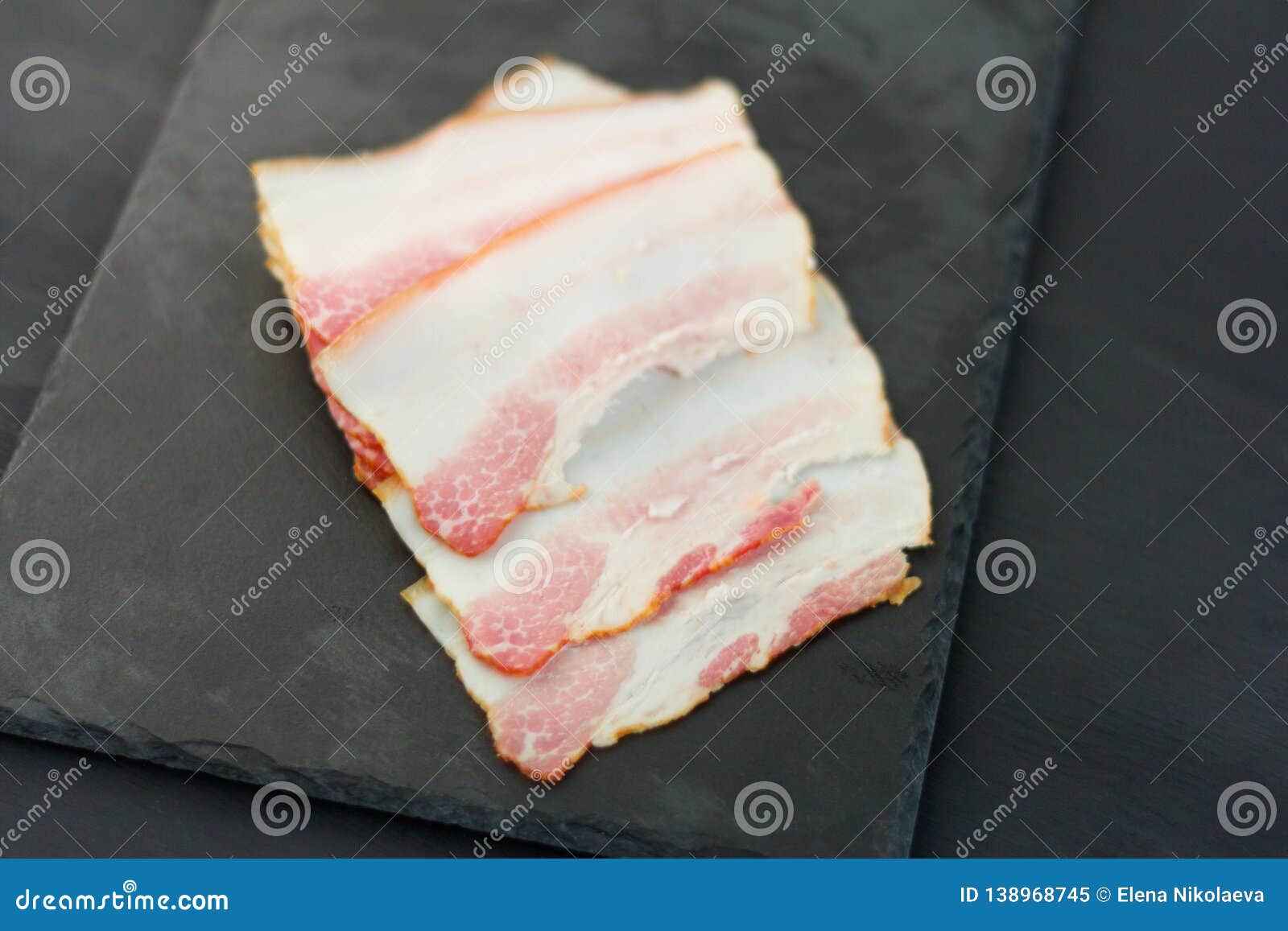 Fresh Tender Bacon Cut into Thin Slices on a Stone Board Stock Image ...