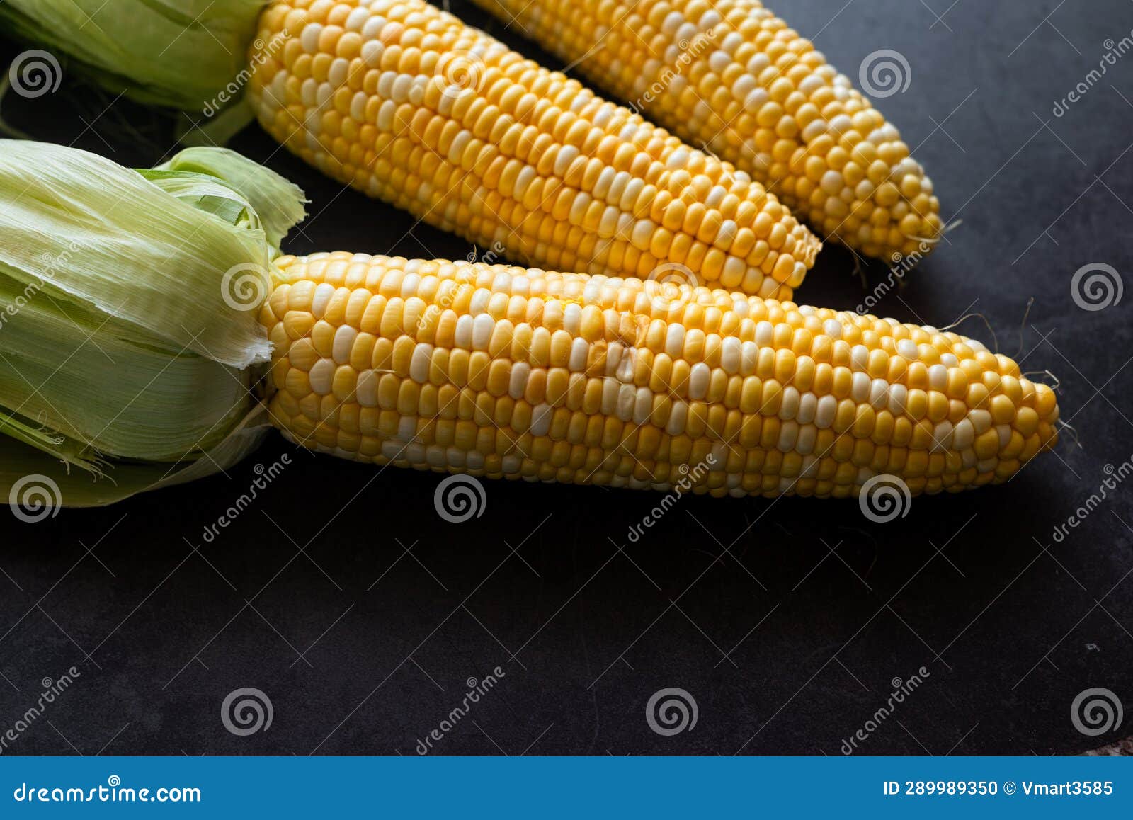 Fresh Three Corn on the Cob on Dark Table, Prepared for Baking Stock ...