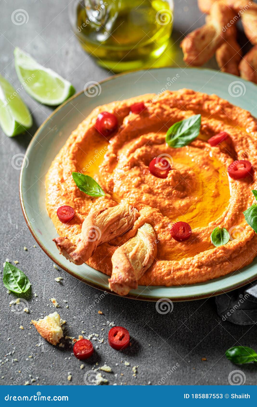 Fresh Tomato Hummus with Breadsticks and Basil Stock Image - Image of ...