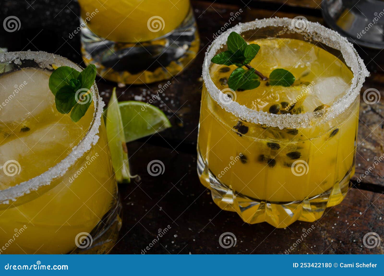 Fresh And Tropical Cocktail With Passion Fruit Lime Mint And Ice