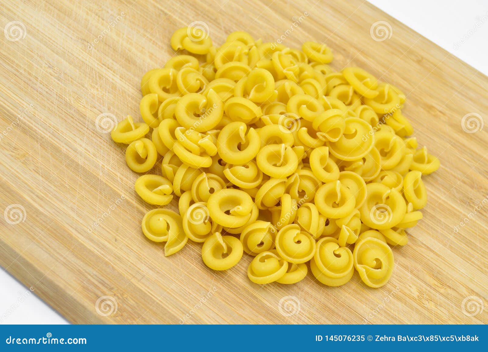 Fresh Uncooked Gold Colored Pasta Stock Image - Image of farfalle ...