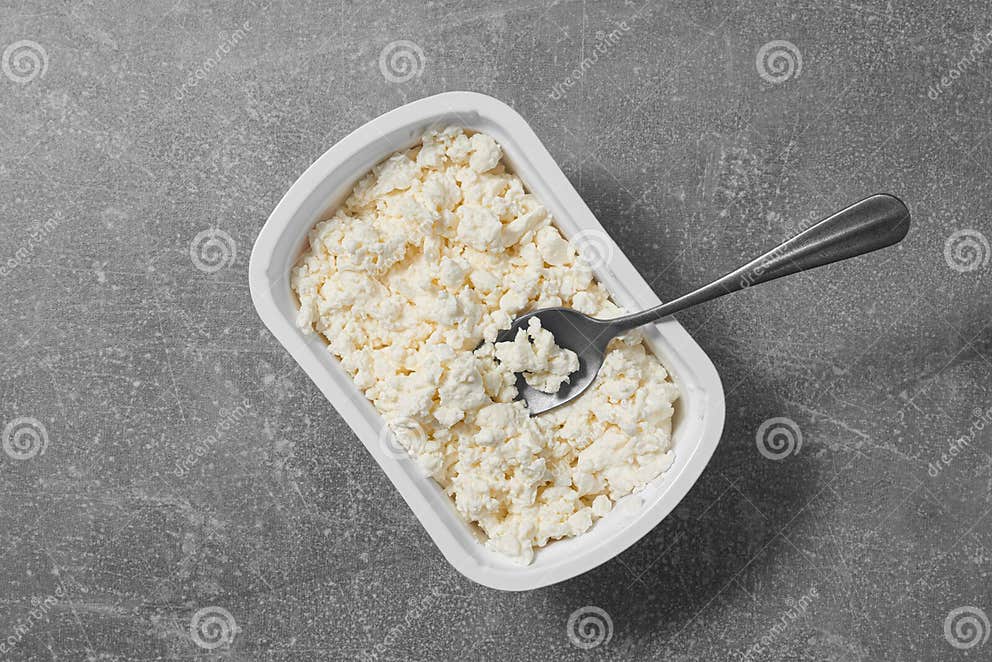 Fresh Unpacked Package of Cottage Cheese on the Table. Top View Stock ...