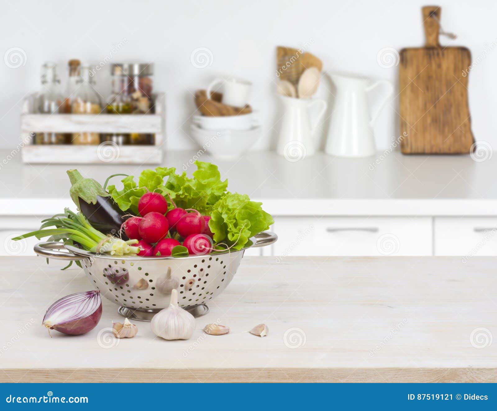 Fresh Vegetables on Wooden Table Over Blurred Kitchen Counter Interior ...