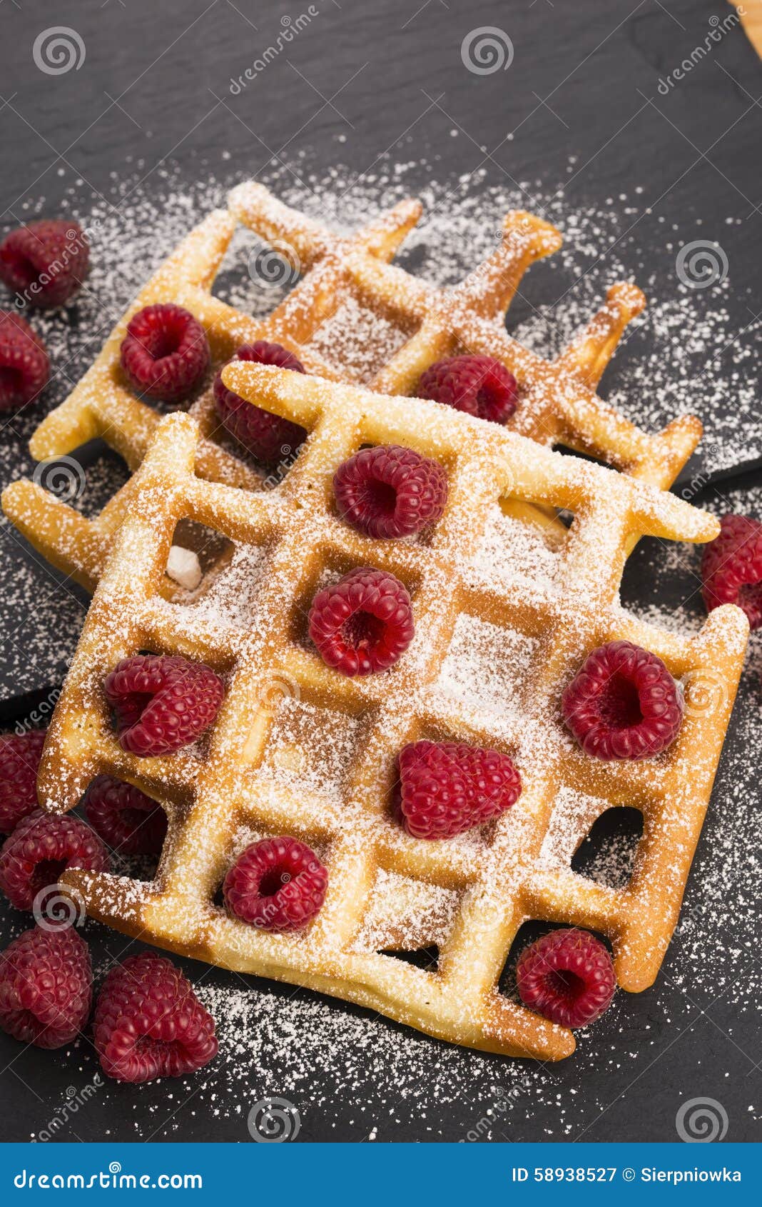 Fresh Waffles Garnished with Powdered Sugar and Raspberries Stock Image ...