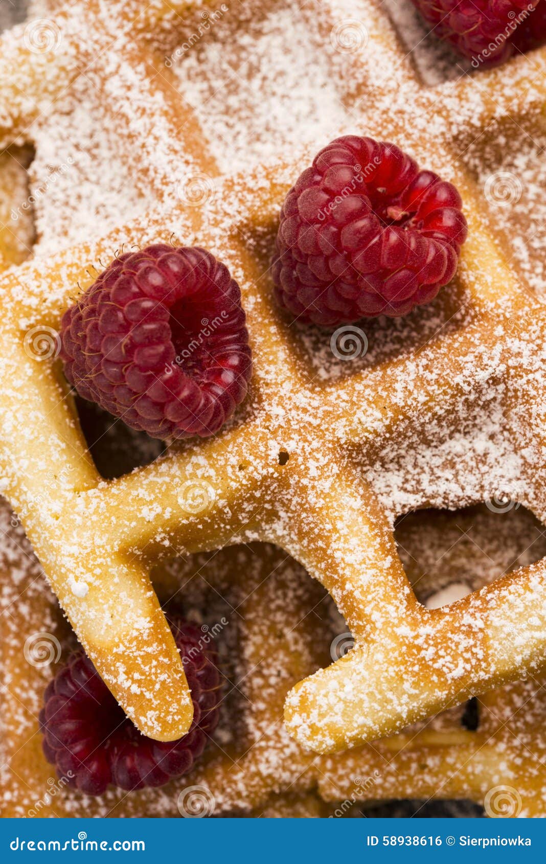 Fresh Waffles Garnished with Powdered Sugar and Raspberries Stock Photo ...