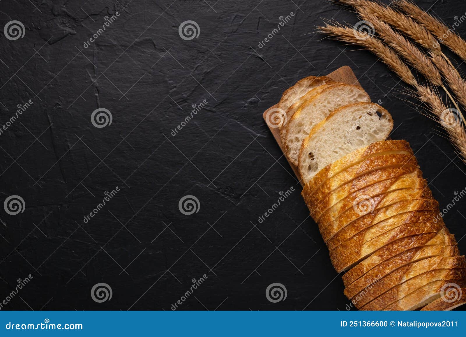 Fresh Wheaten Baton Bread on Dark Background. Top View Stock Photo ...