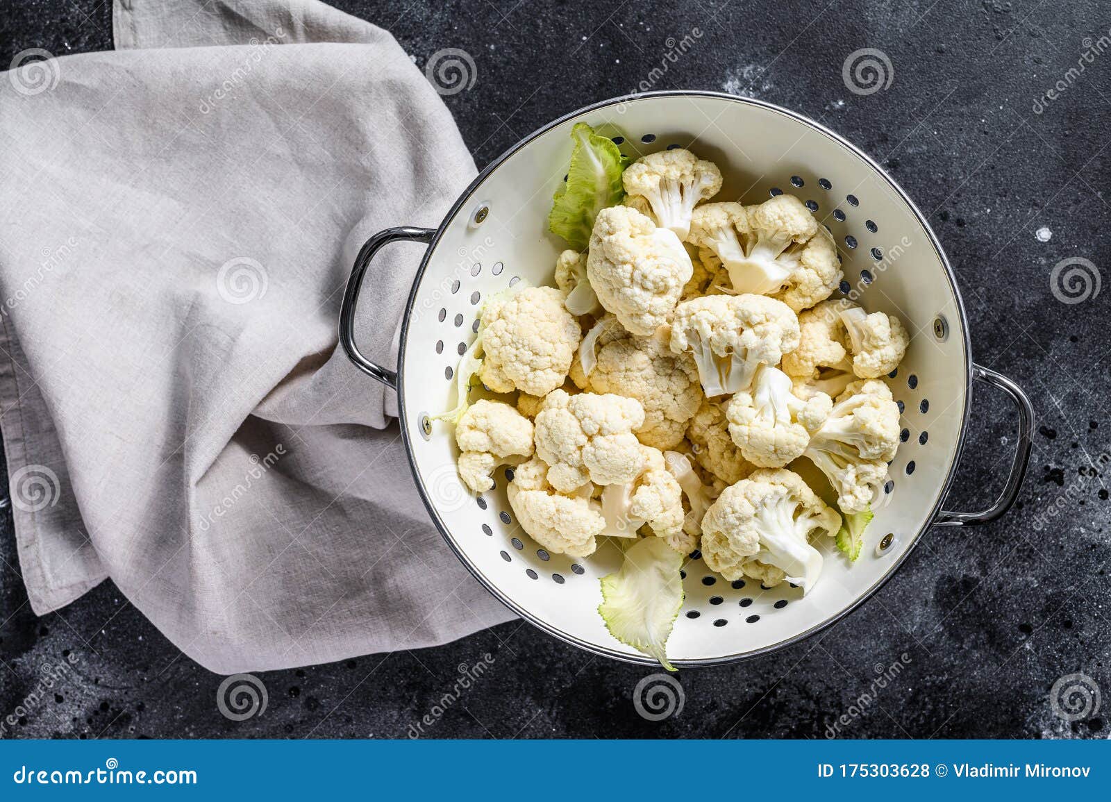 Fresh White Heads Cleaned Cauliflower in a Colander. Black Background ...
