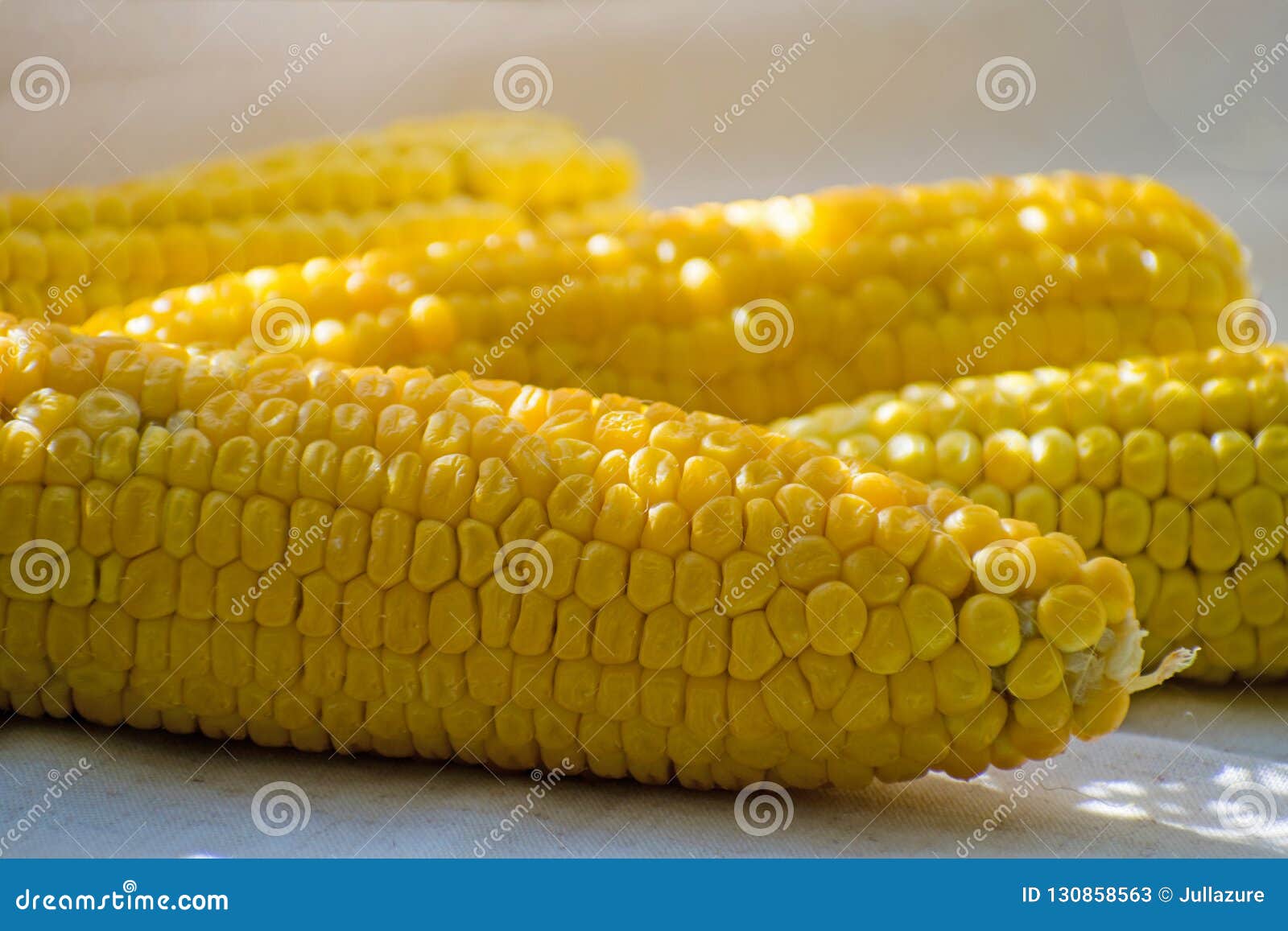 Fresh Yellow Corn. Row of Delicious Boiled Fresh Corn Cobs for a ...