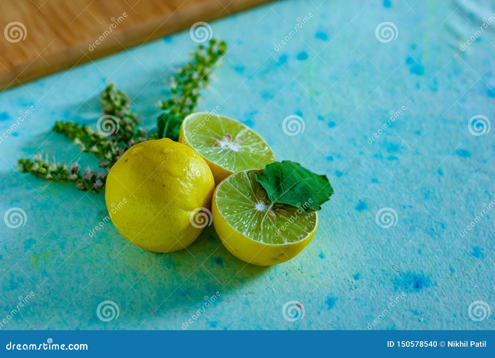 Fresh Yellow and Green Lemon on Blue Background Stock Photo - Image of ...