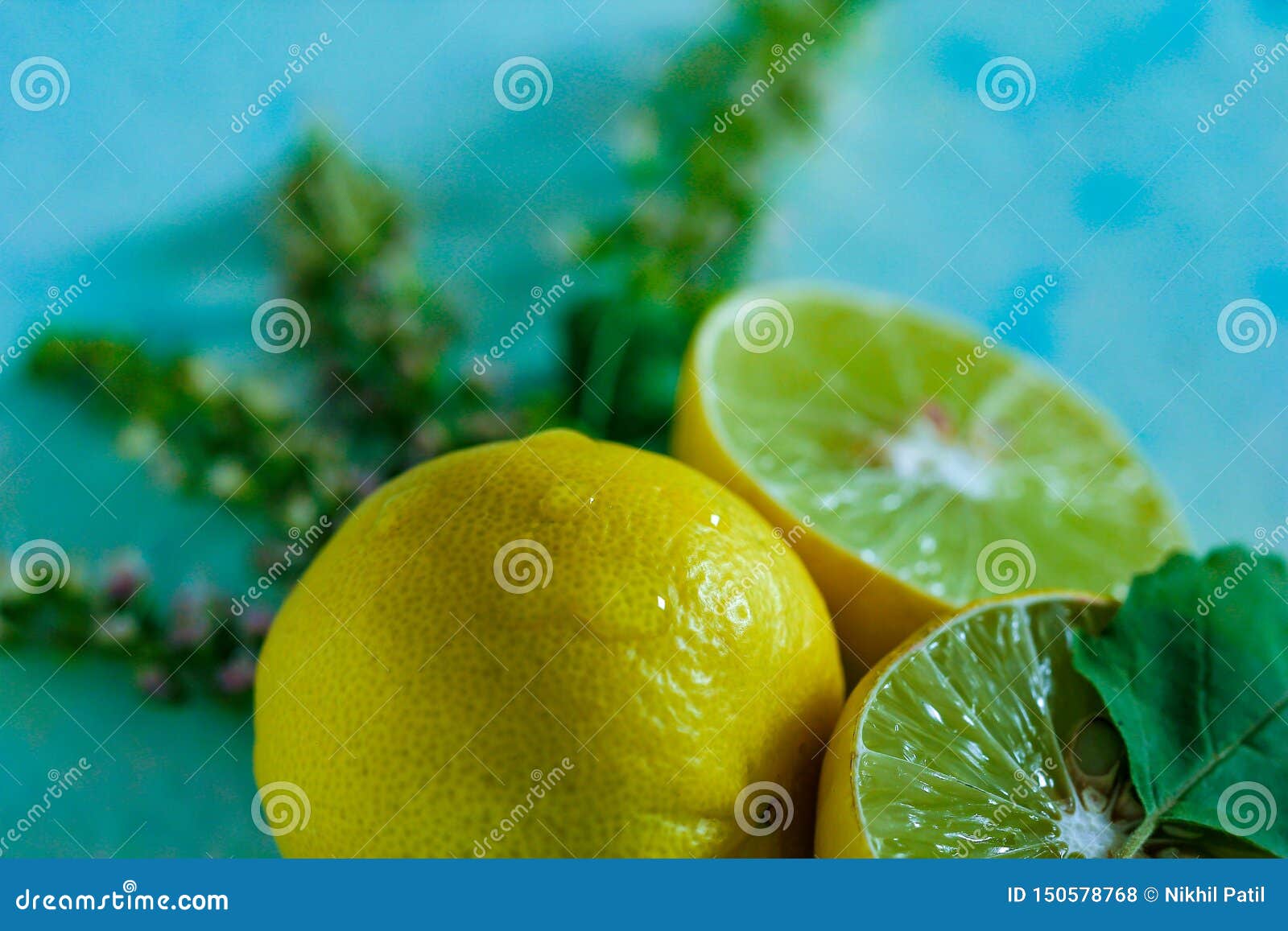Fresh Yellow and Green Lemon on Blue Background Stock Photo - Image of ...
