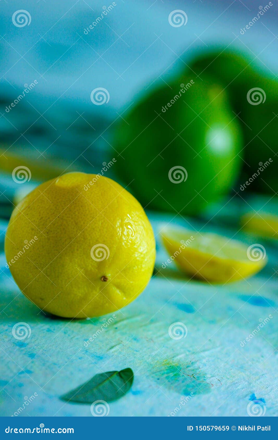 Fresh Yellow and Green Lemon on Blue Background Stock Image - Image of ...