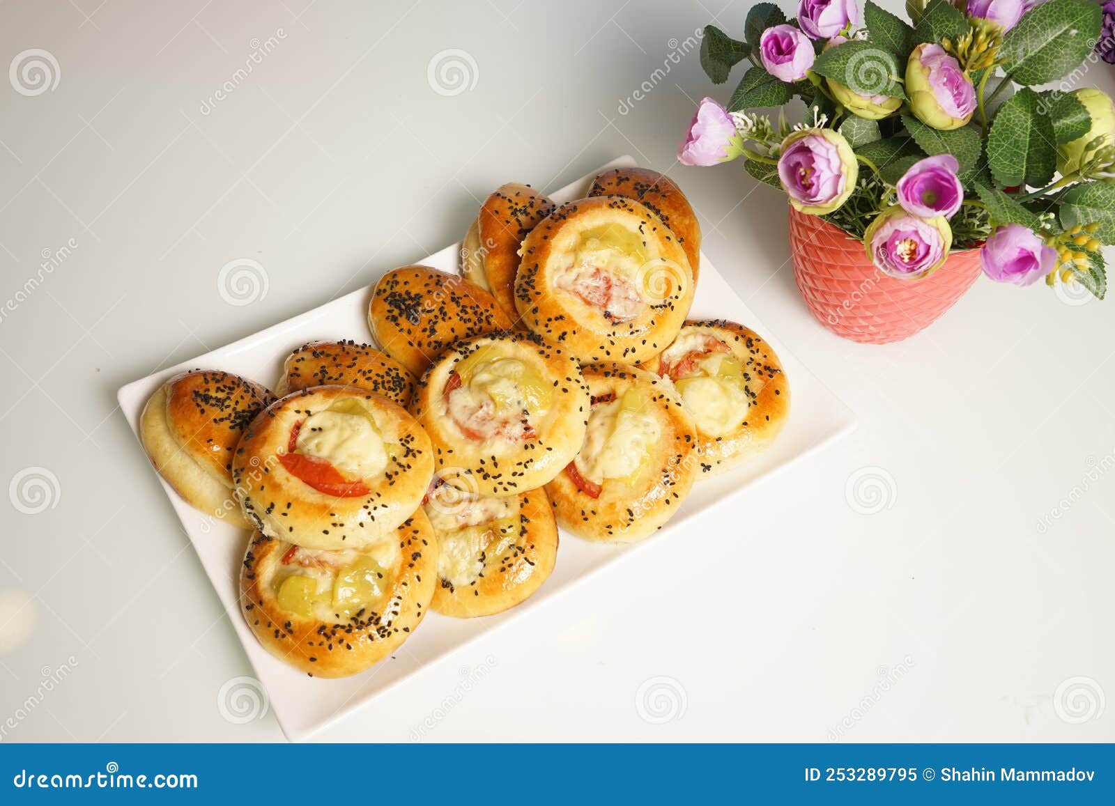 Freshly Baked Assorted Rolls with a Stuffing in a White Plate on the ...