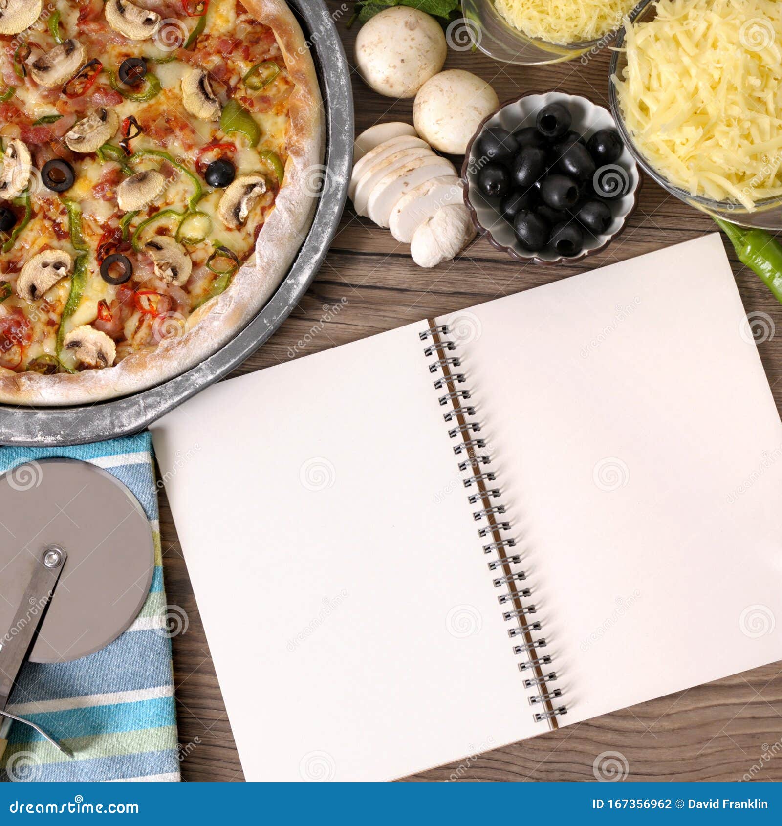 Freshly Baked Pizza with Cookbook Stock Photo - Image of worktop ...