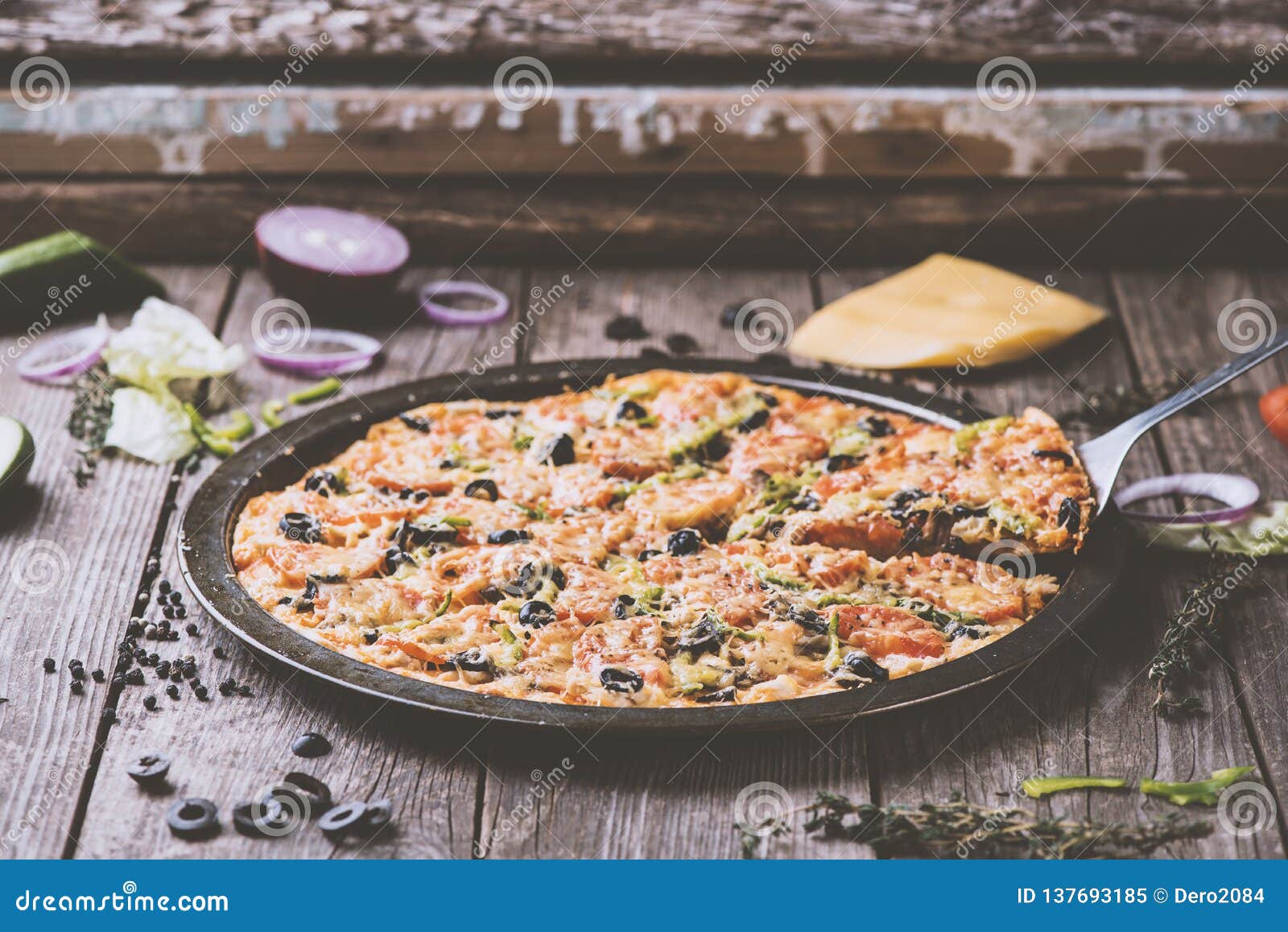 Freshly Baked Pizza in Pizza Mold and on Wooden Table. Matte Effect ...