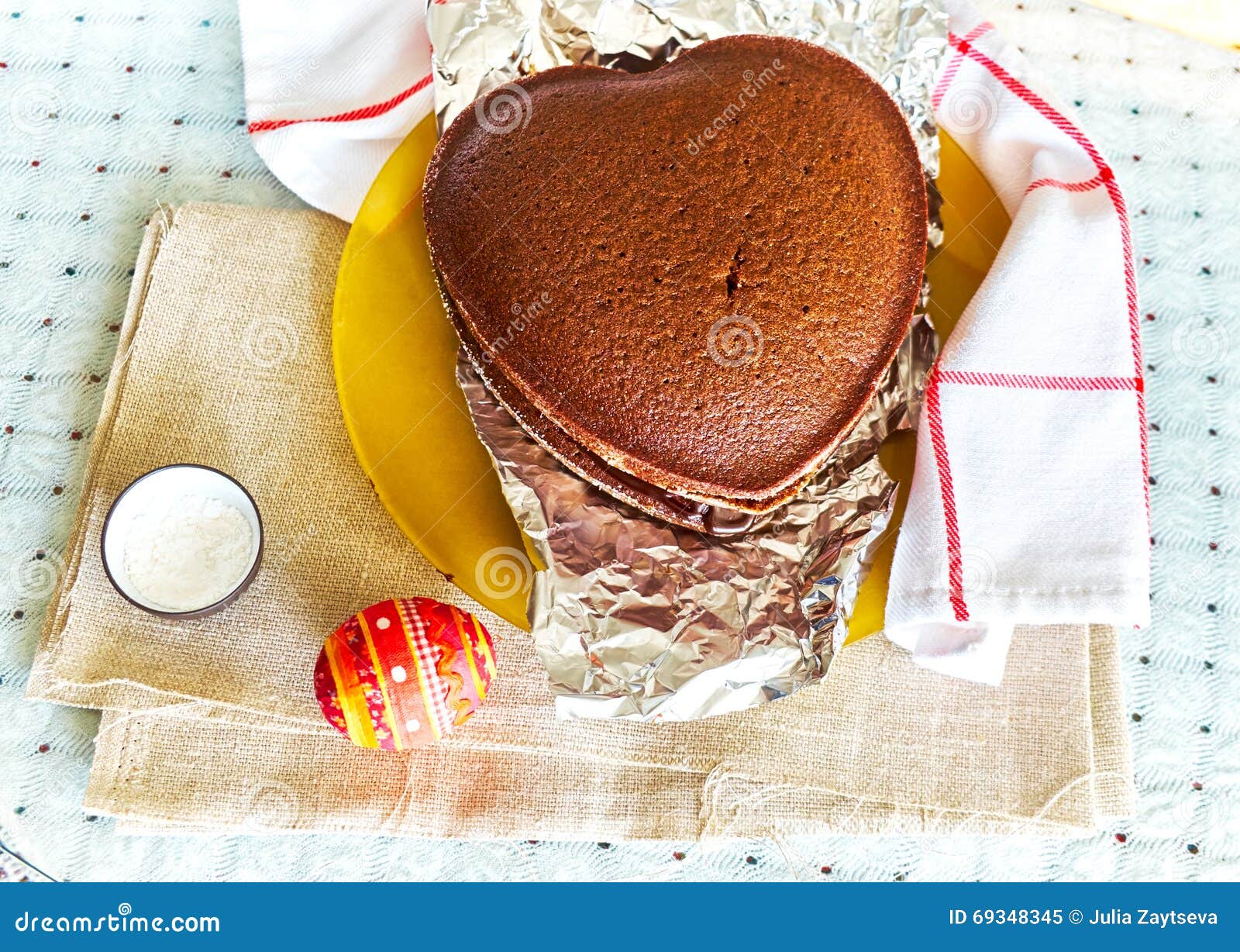 Freshly Baked Sponge Cake in the Shape of Heart and Souvenir Easter Egg ...