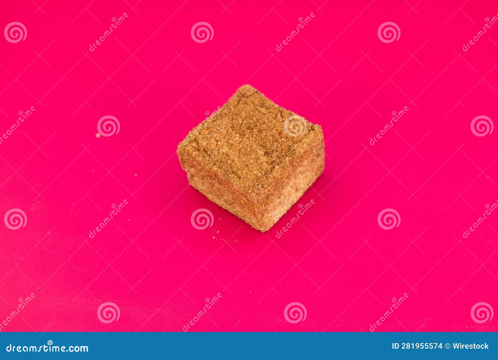 A Square Pastry on a Pink Surface with Some White Sugar Stock Photo ...
