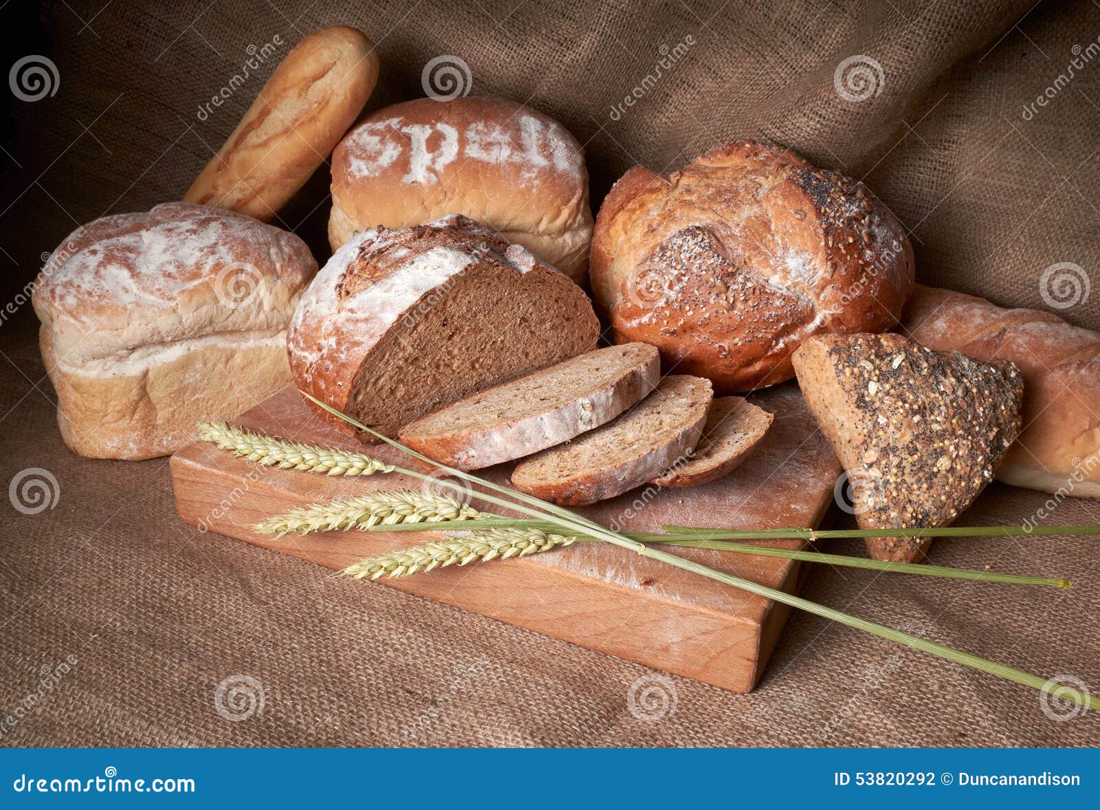 Freshly Baked Traditional Bread on a Table Stock Photo - Image of cloth ...