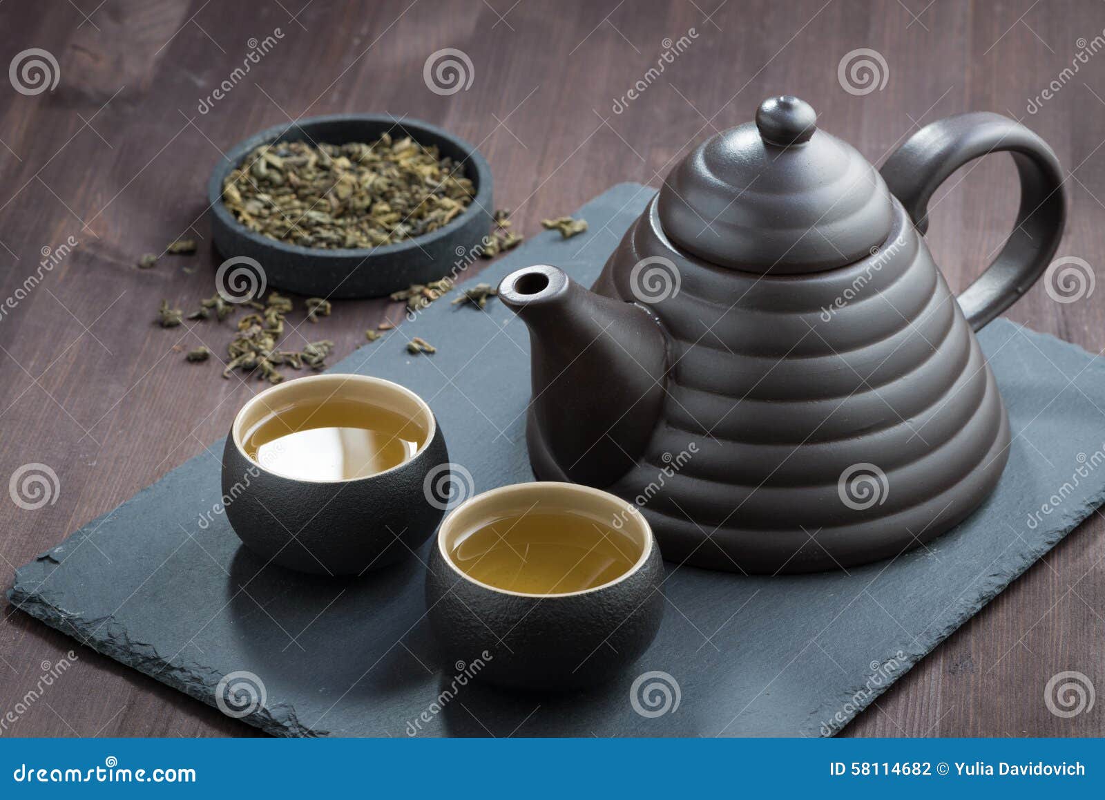 Freshly Brewed Green Tea in Ceramic Ware on Wooden Table Stock Photo ...