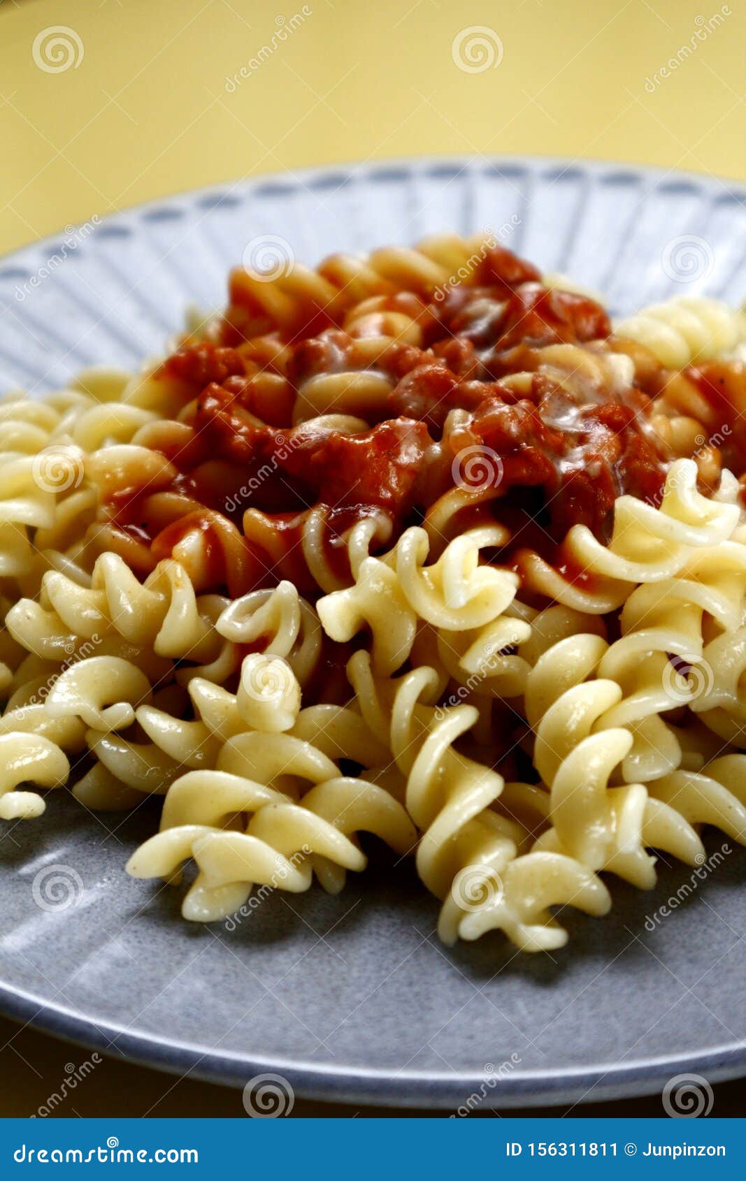 Freshly Cooked Spiral Pasta With Cheese And Tomato Sauce Stock Image