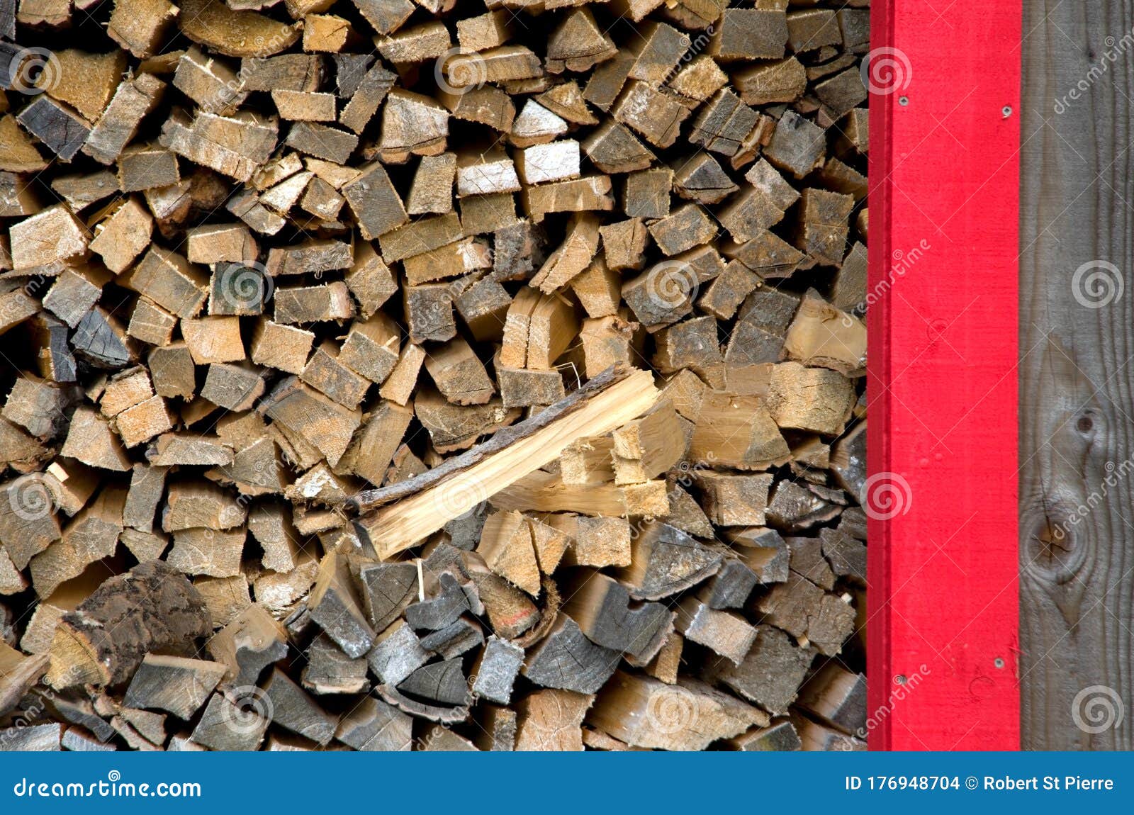 Freshly Cut Fire Wood with Red Barn Door Stock Photo - Image of lumber ...