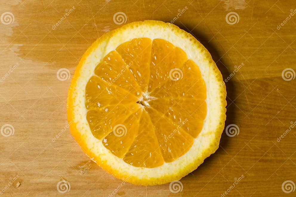 Freshly Cut Orange Fruit Wheel Stock Image - Image of farmfresh, table ...
