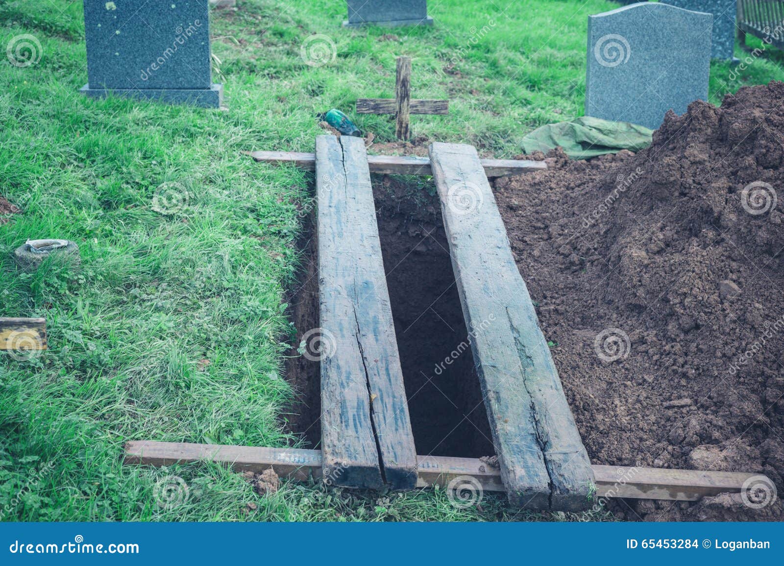 Freshly Dug Grave In Cemetery With Headstones And Green Grass Royalty ...
