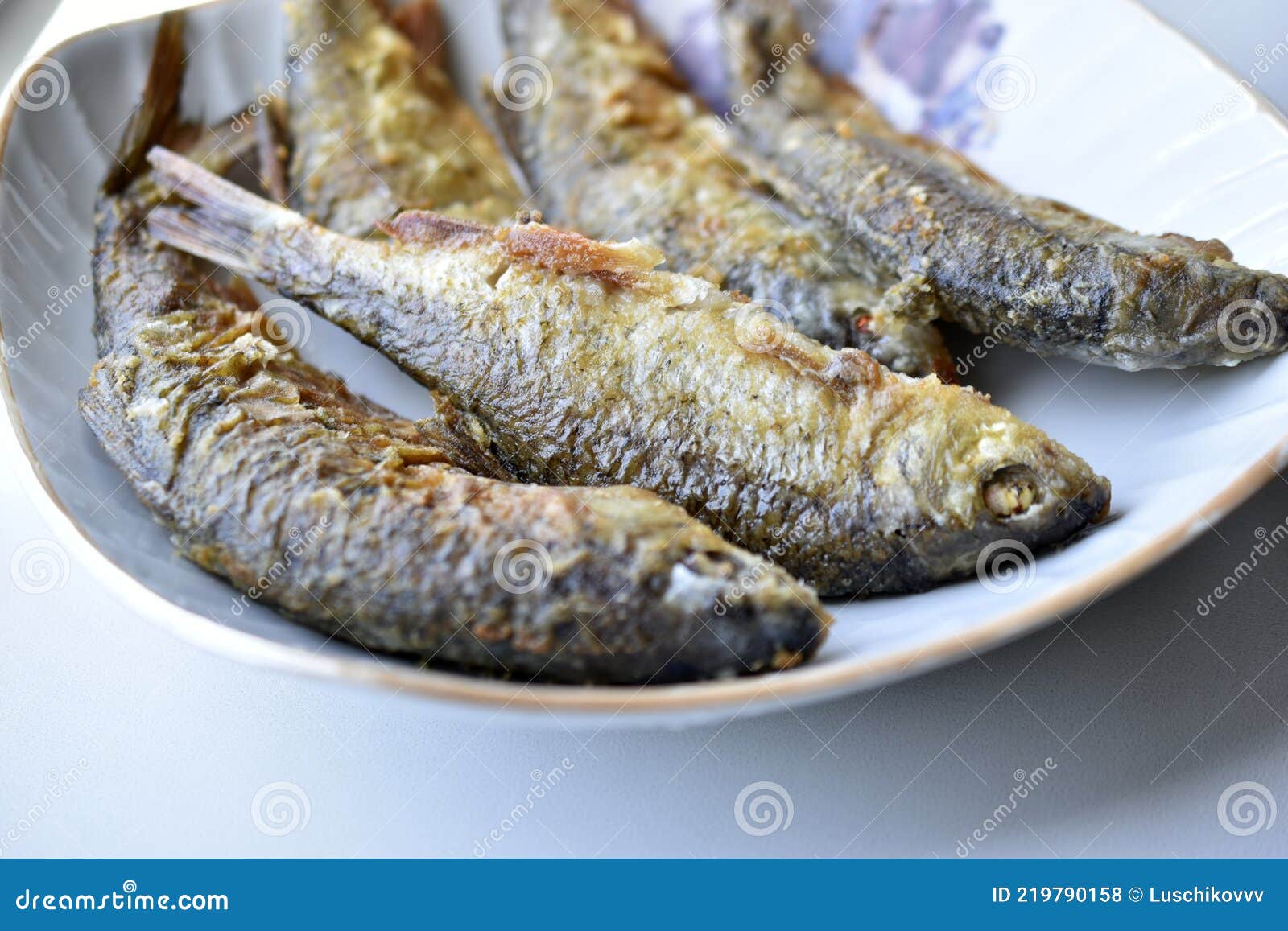 Freshly Fried River Fish in a Plate in the Kitchen Stock Photo - Image ...