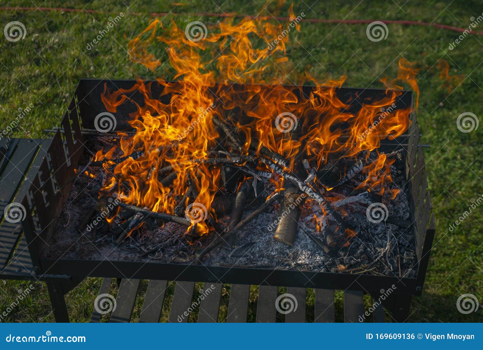 Freshly lit barbecue fire stock photo. Image of fire - 169609136