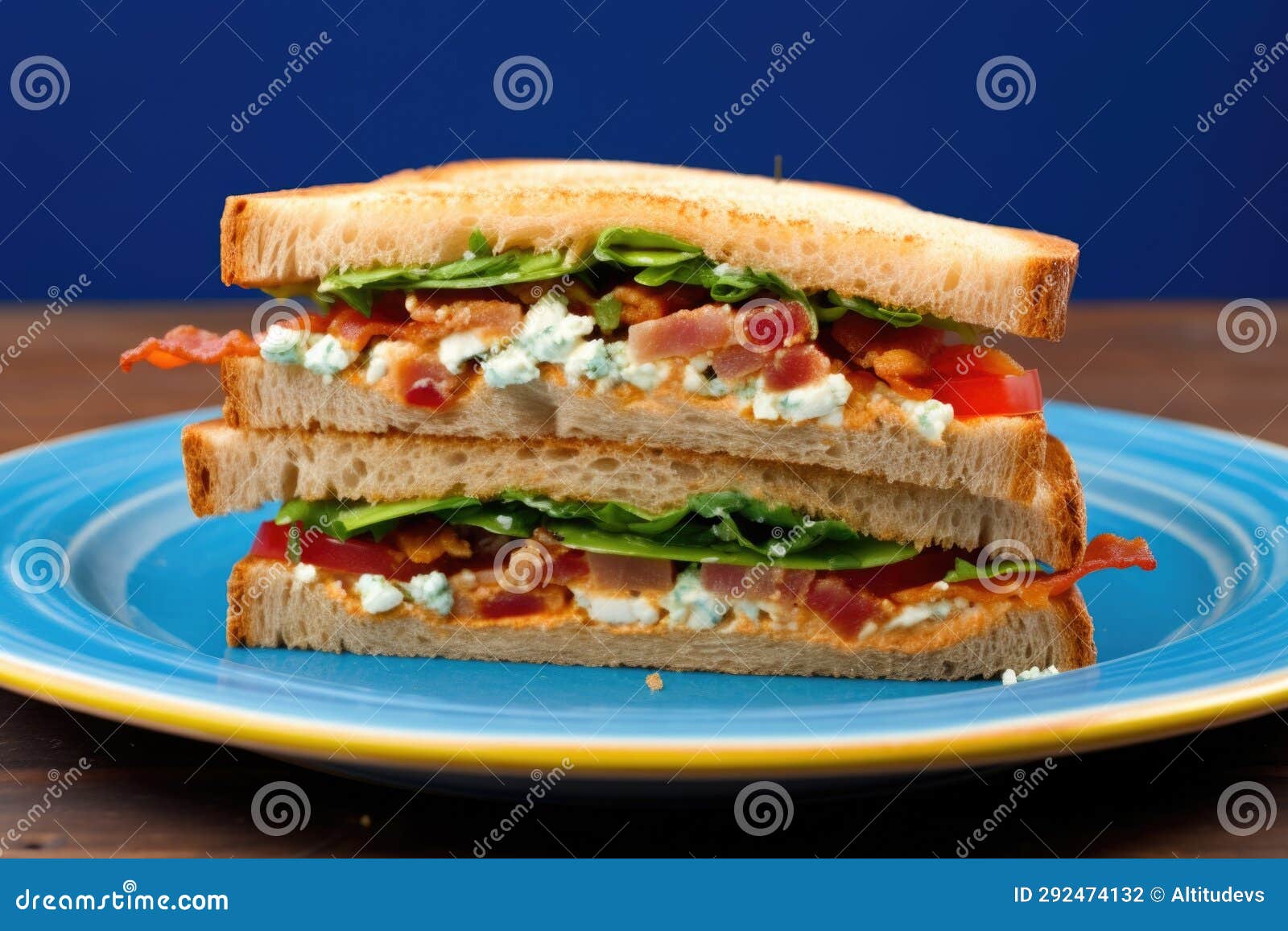 Freshly Made Bacon Sandwich on a Bright Blue Plate Stock Photo - Image ...