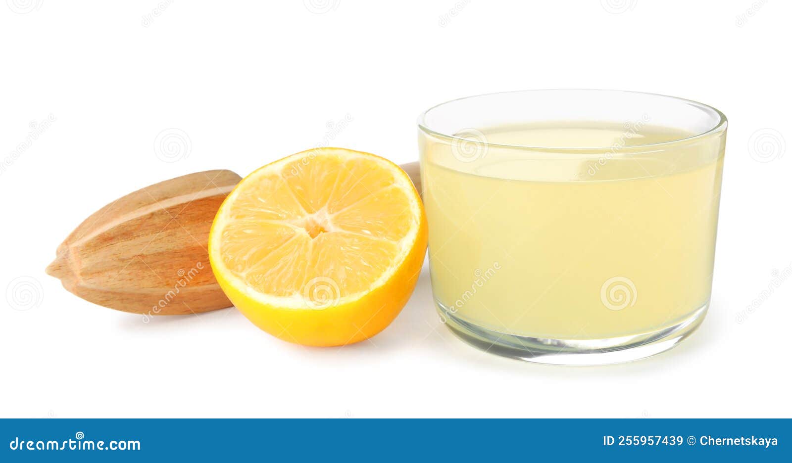 Freshly Squeezed Juice, Half of Lemon and Reamer on White Background ...