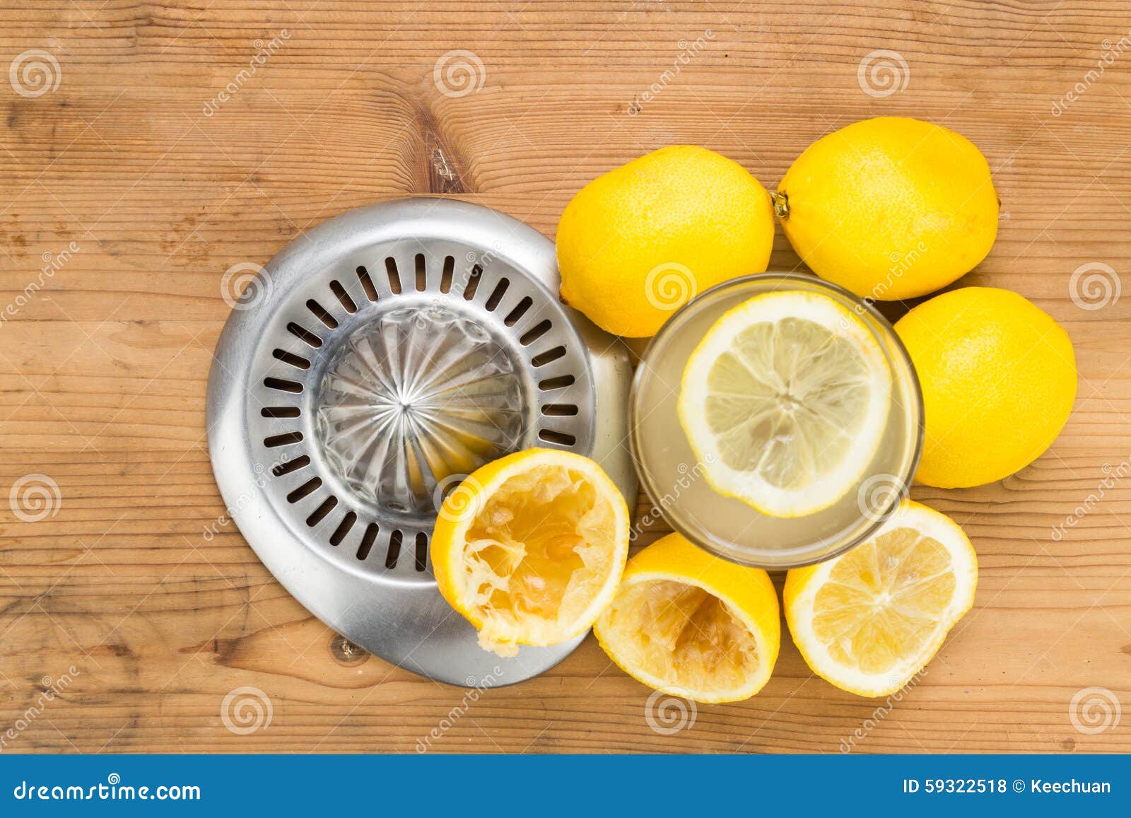 Freshly Squeezed Organic Lemon Juice with Glass and Squeezer. Stock ...