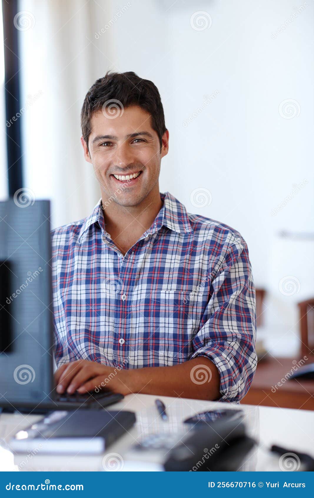 Friday Smiles. a Happy Young Man Sitting at a Desk in Front of a ...