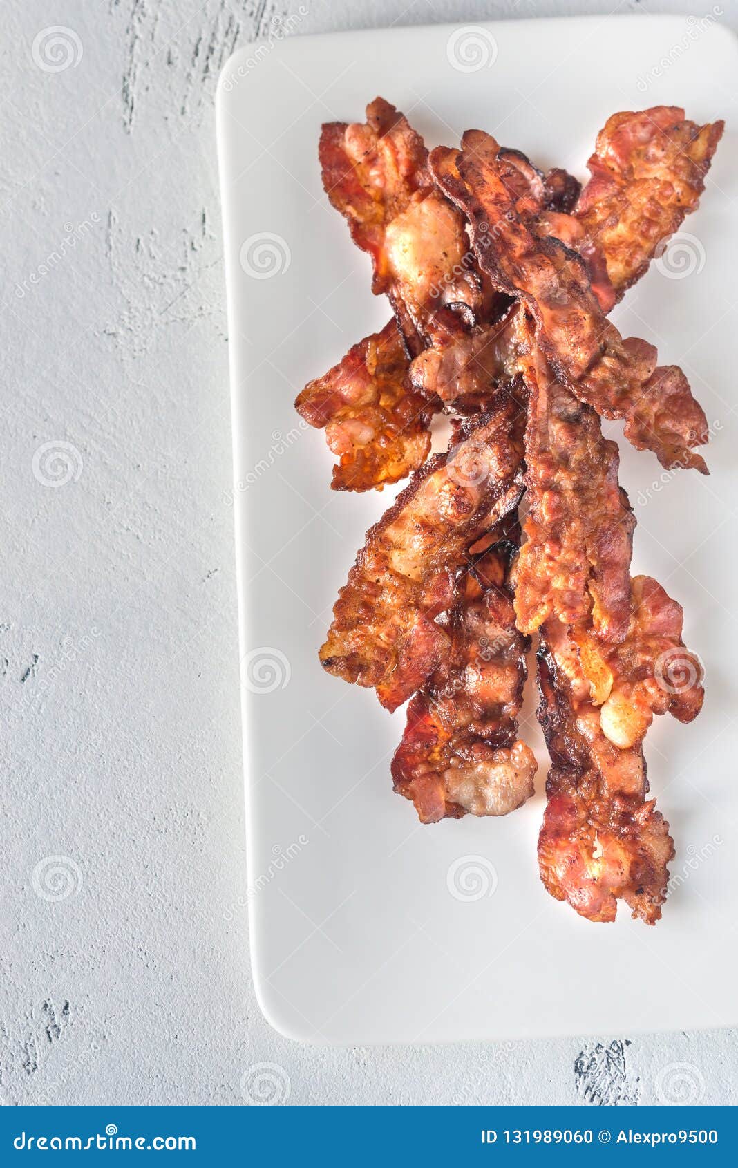 Fried Bacon Strips on the White Plate Stock Photo - Image of fried ...