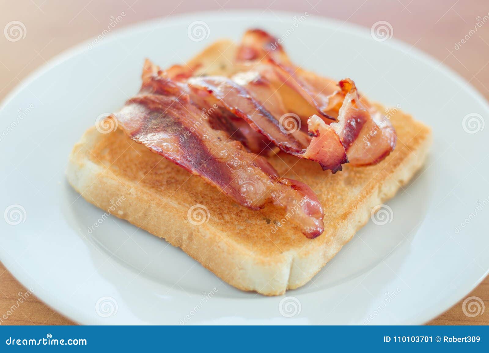 Fried bacon on toast. stock image. Image of cooked, dish - 110103701