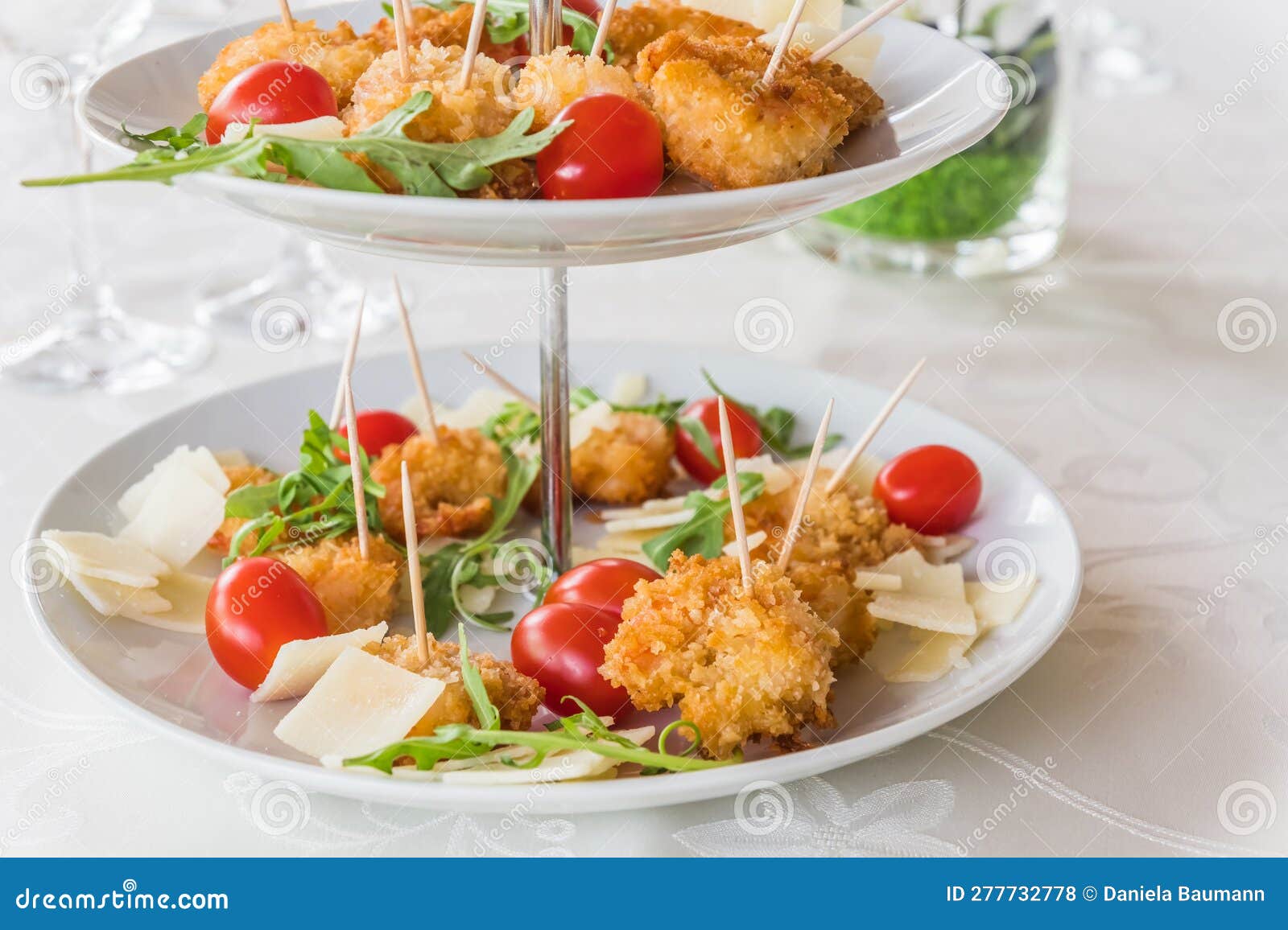 Fried Breaded Prawns with Rocket Salad on a Porcelain Cake Stand Stock ...