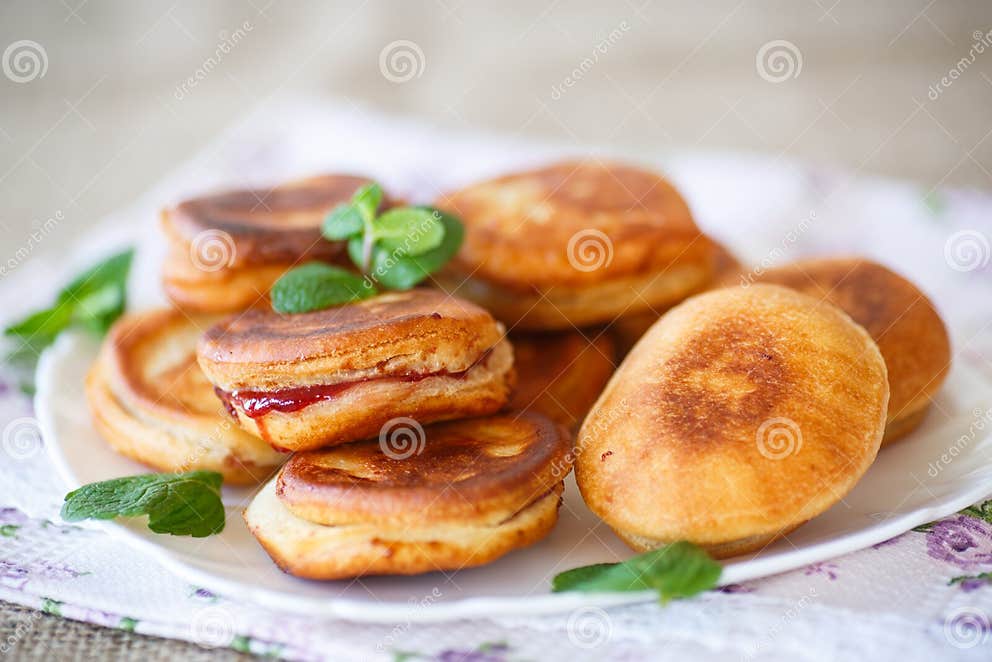 Fried cakes with jam stock photo. Image of green, donuts - 48306140