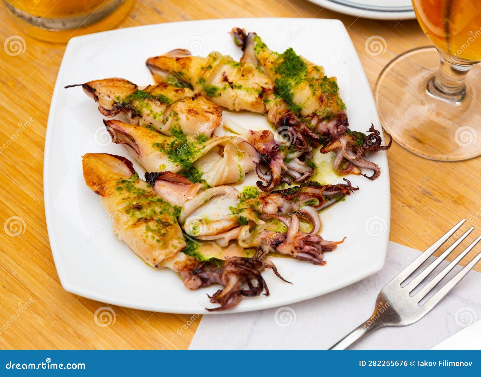 Fried Calamari with Pesto Sauce Served in a Plate Stock Photo - Image ...