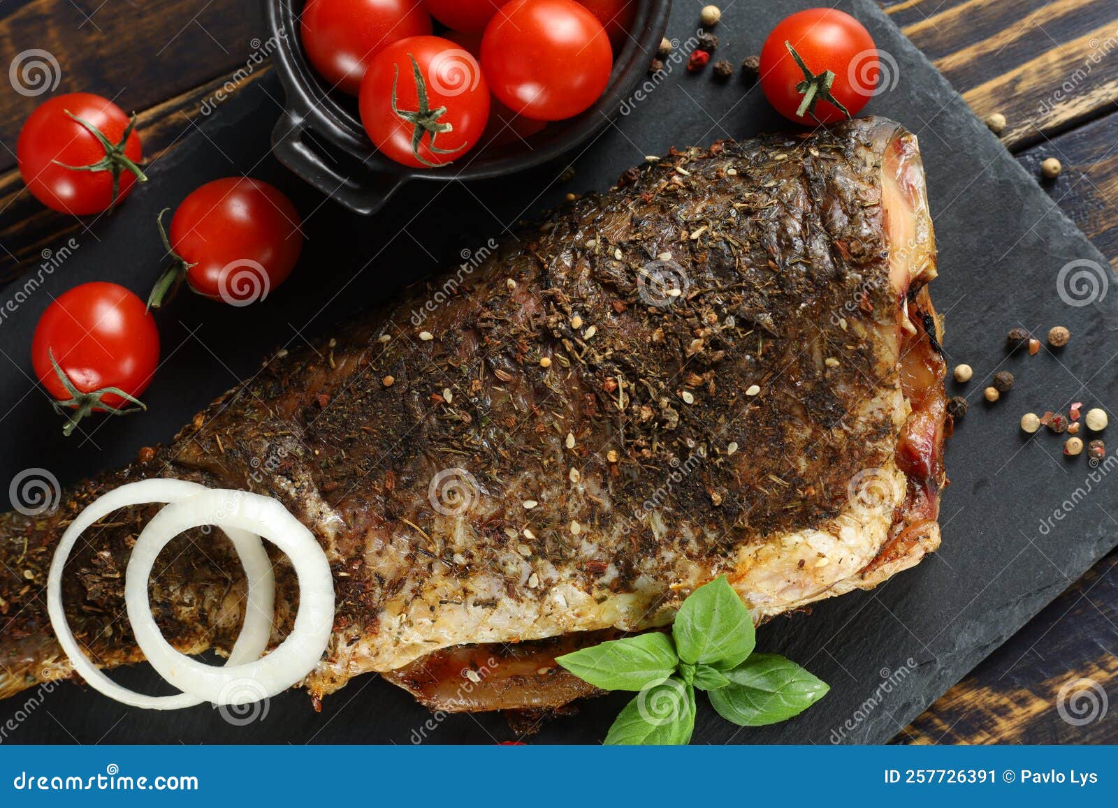 Fried Carp Fish on the Table. Baked Fish with Vegetables Stock Image ...